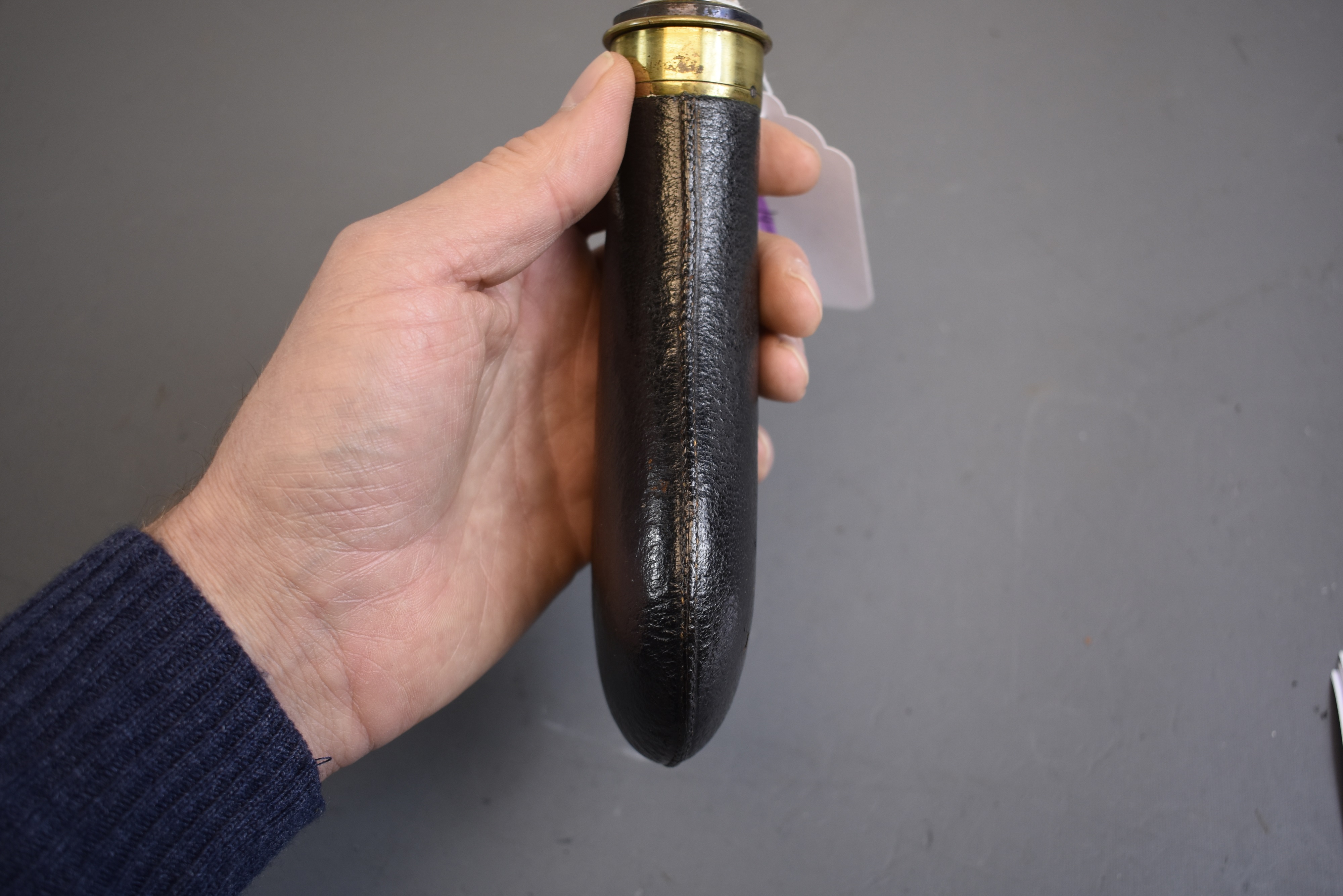 Lot 483 - A LEATHER COVERED GUN OR RIFLE FLASK,