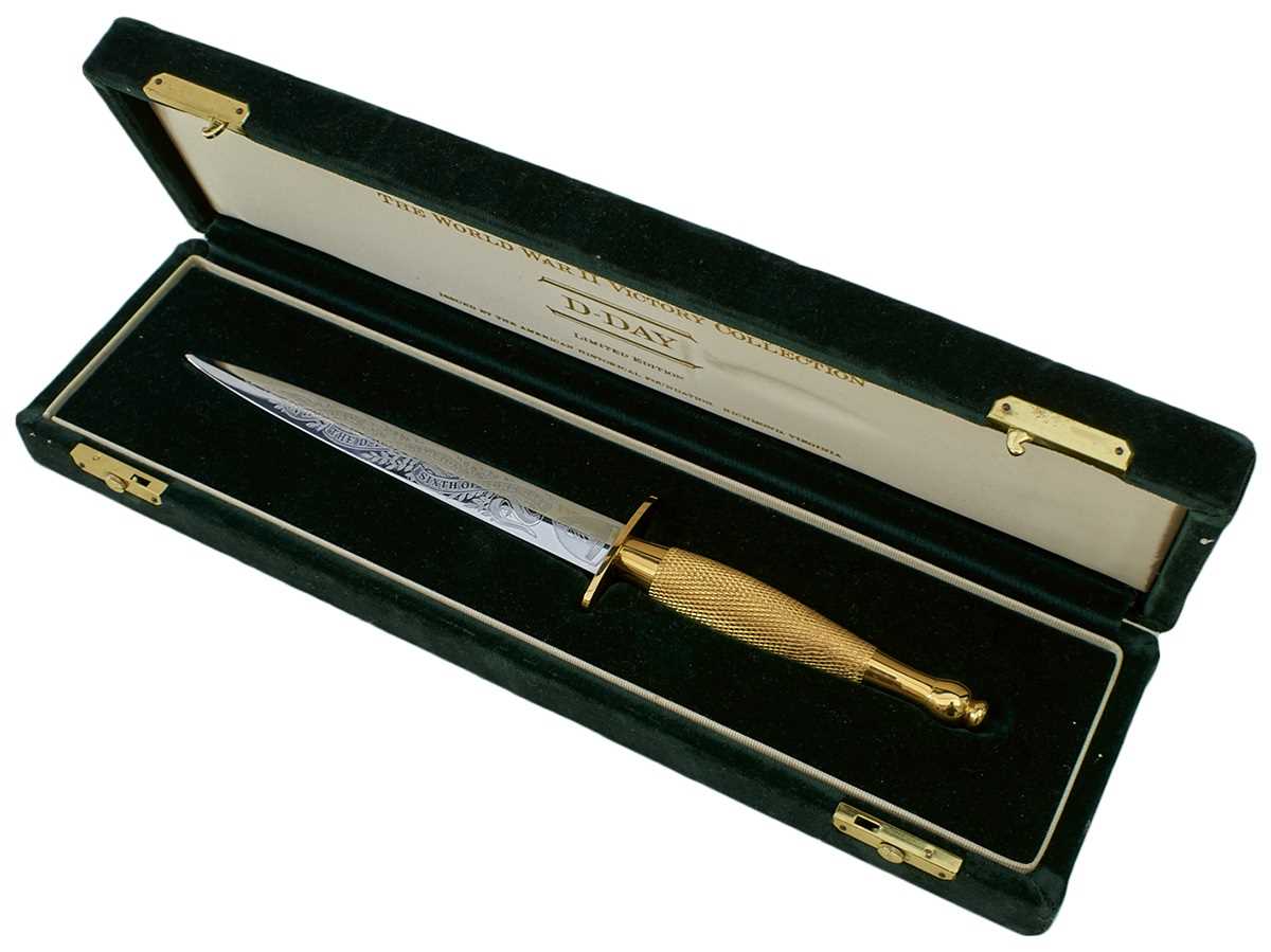 Lot 513 - A D-DAY COMMEMORATIVE WILKINSON SWORD