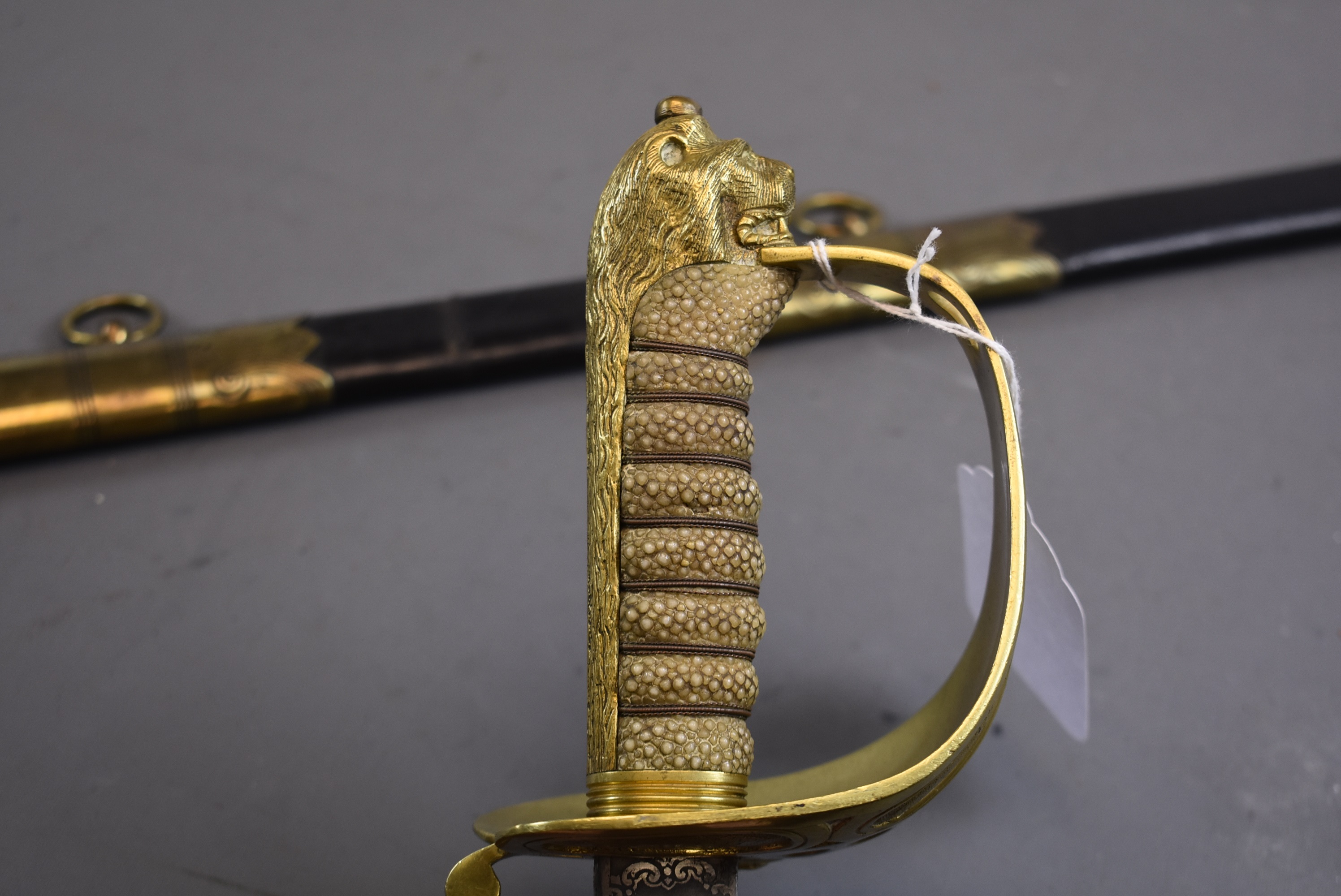Lot 606 - A ROYAL NAVAL OFFICER'S SWORD,