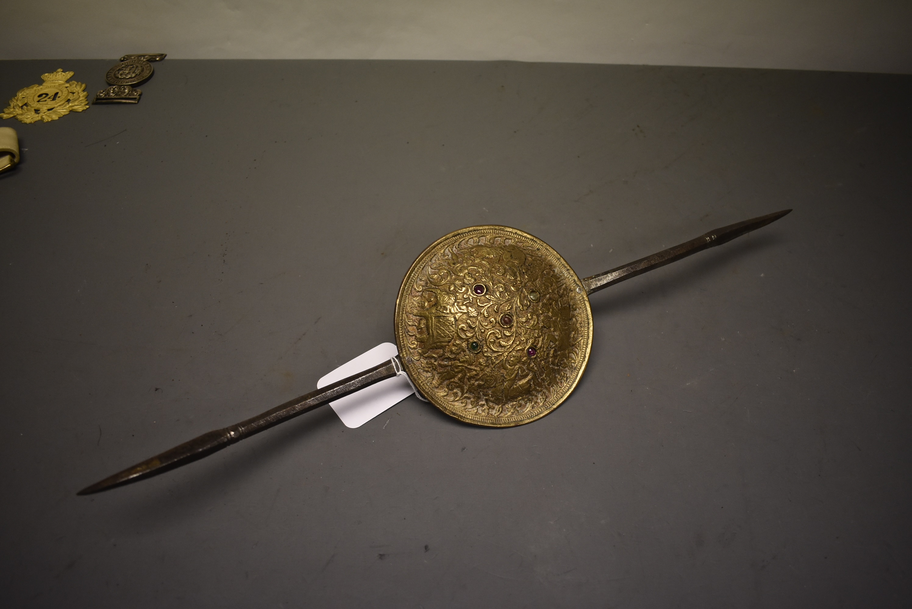 Lot 61 - A 19TH CENTURY INDIAN MADU OR SHIELD,