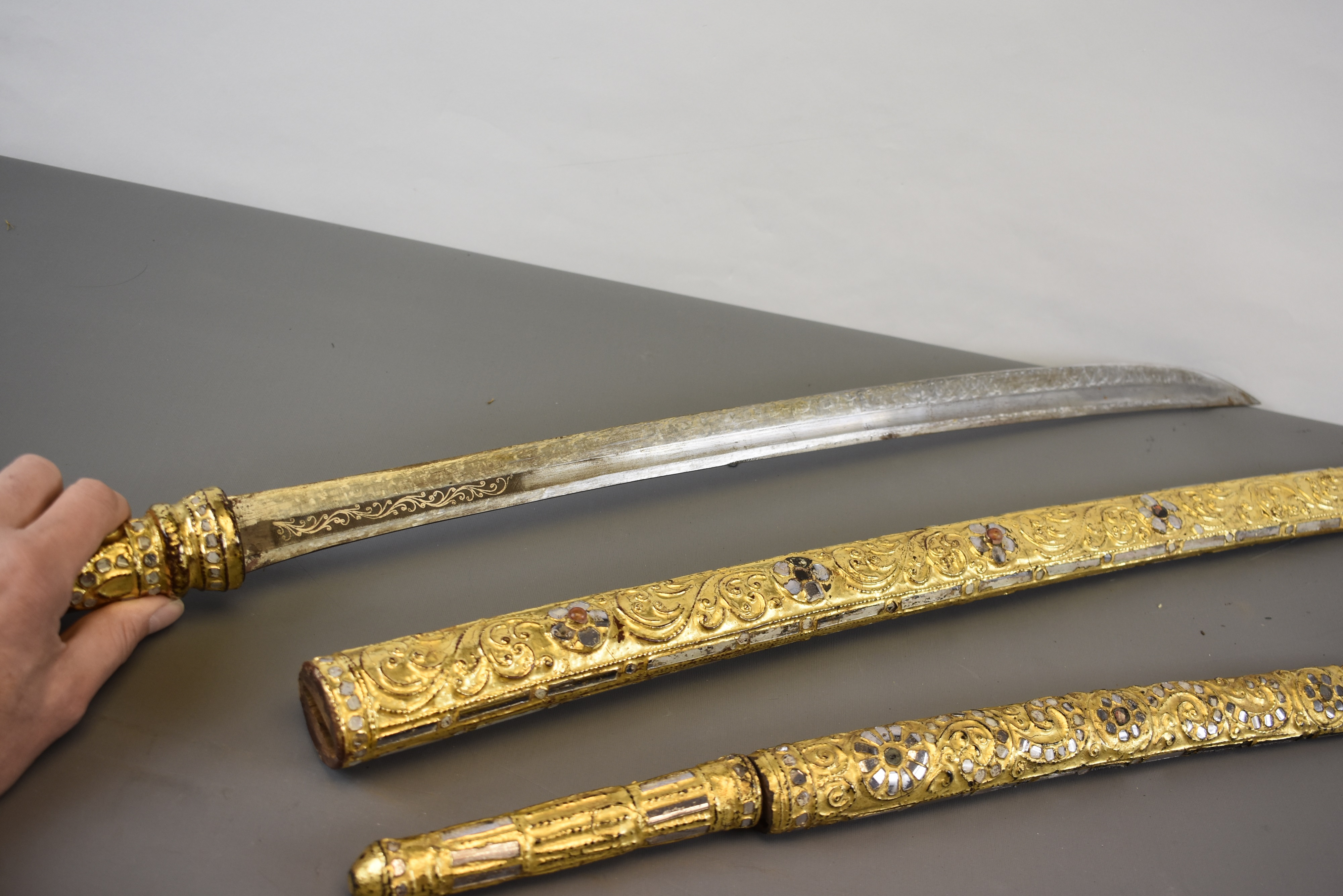 Lot 28 - A BRACE OF ORNATE GILT THAI TEMPLE SWORDS,
